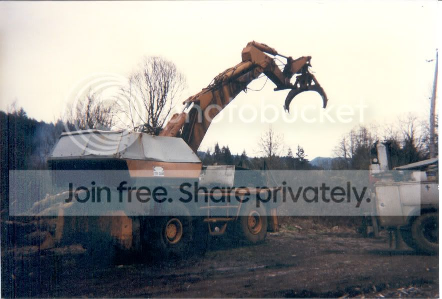 Hydraulic Excavators turned into Log Loader, then put on Rubber Tire SP ...